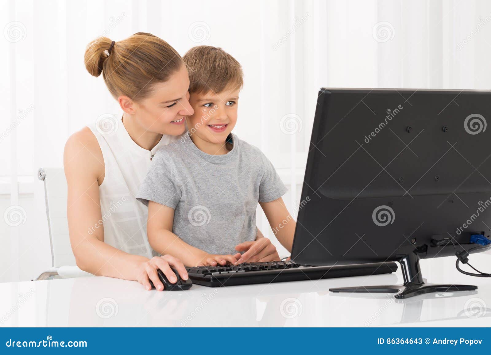 Mother and Son Using Computer Stock Image - Image of playing, smiling ... Mother and Son Using Computer Stock Image - Image of playing, smiling ...