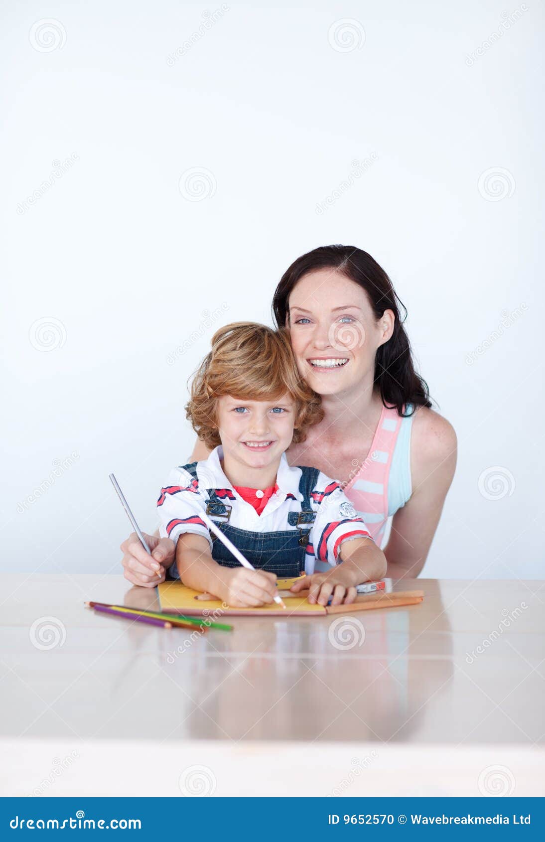 Mother and Son Writing and Smiling To the Camera Stock Photo - Image of ...