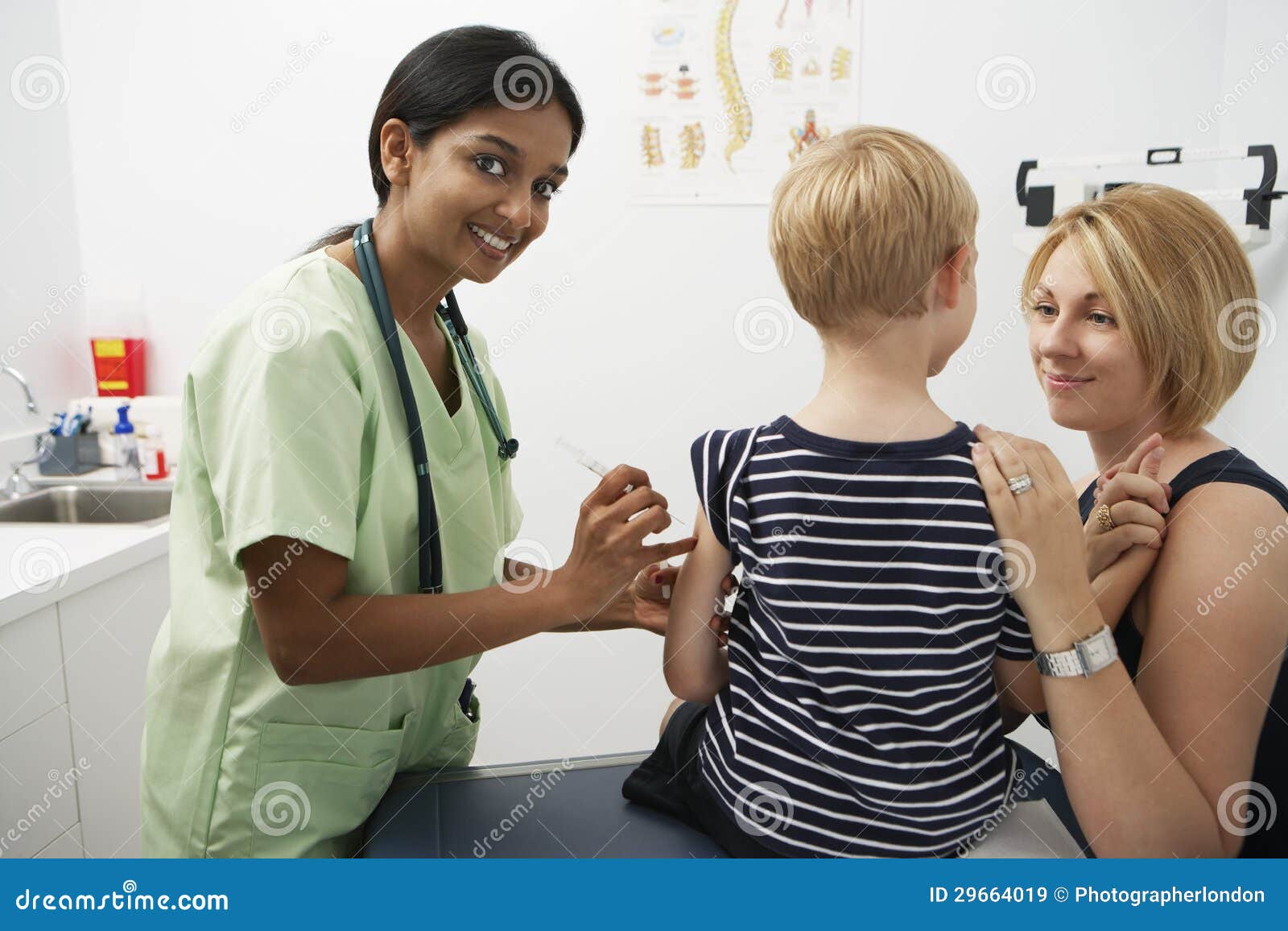 Mother Supporting Boy Receiving Injection Stock Image - Image of clinic ...