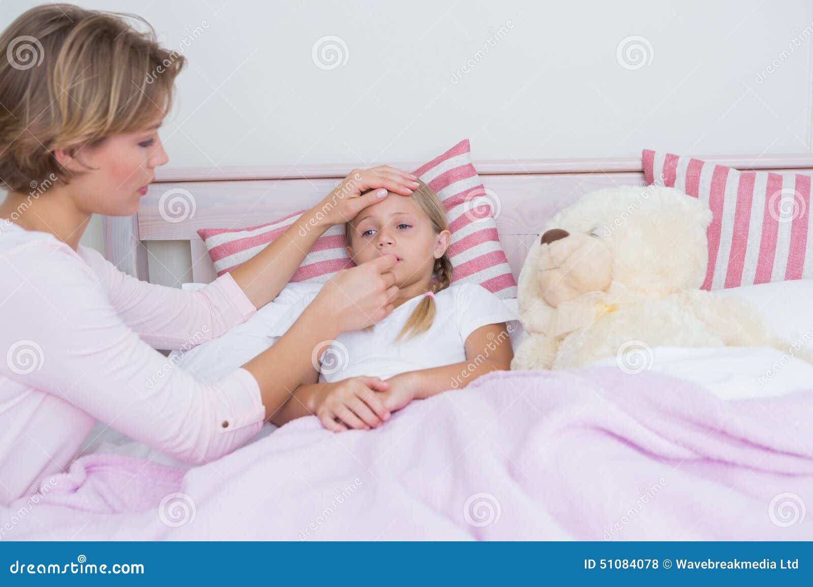 Mother Taking the Temperature of Sick Daughter Stock Photo - Image of ...