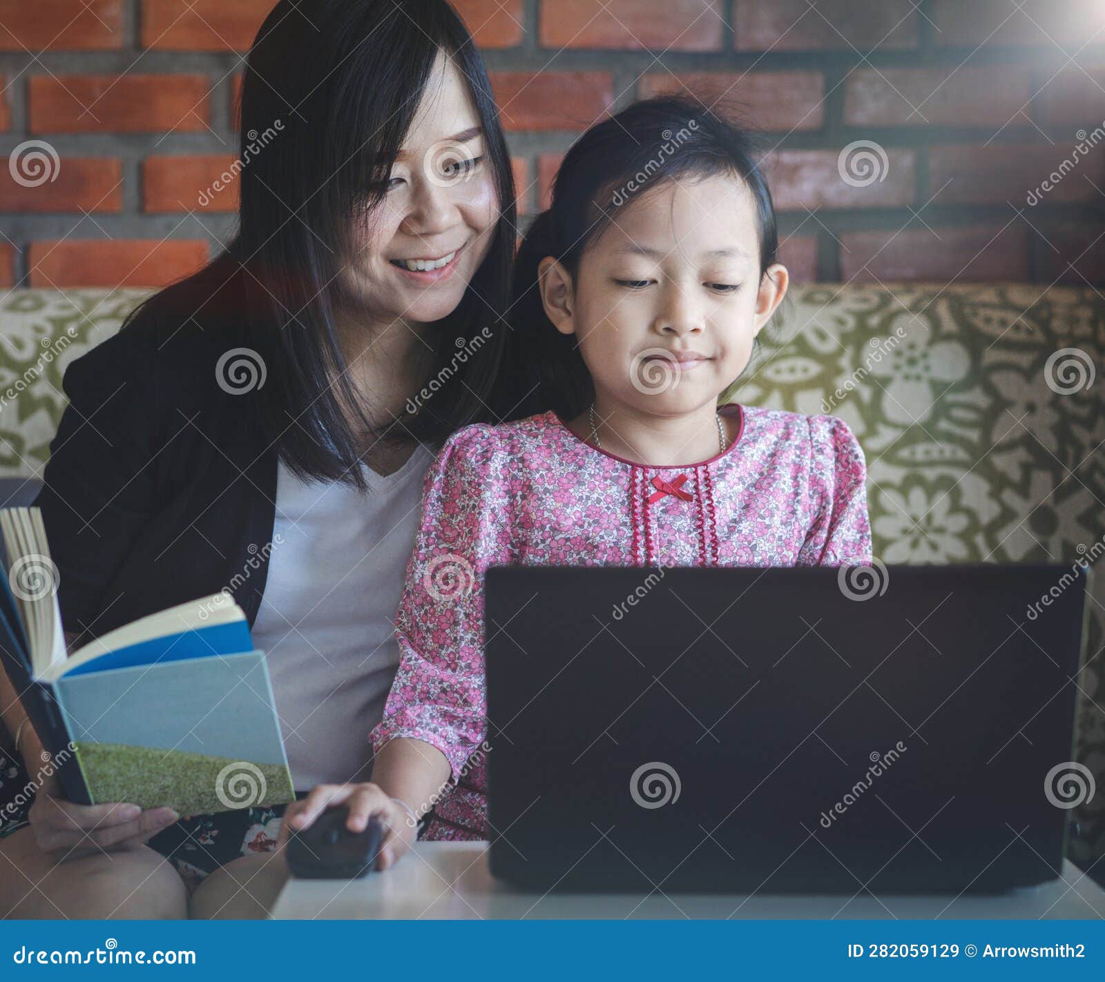 A Mother Teaches His Daughter How To Use a Computer To Study Online and ...