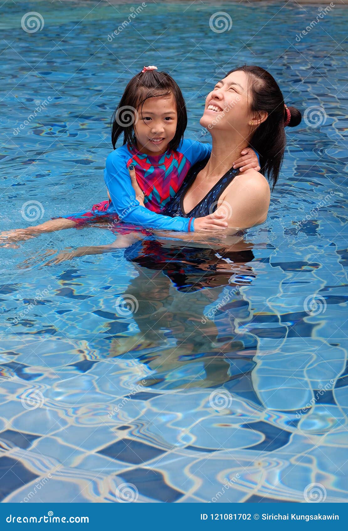 A Mother Teaching Her Daughter To Swim Stock Photo - Image of girl ... A Mother Teaching Her Daughter To Swim Stock Photo - Image of girl ...