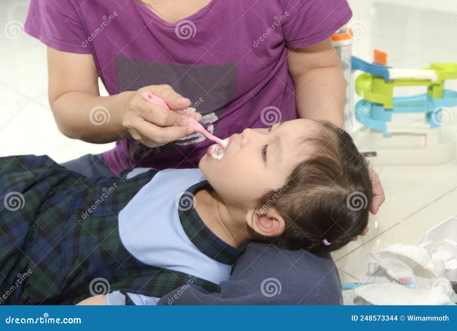 Mother Teaching Her Little Daughter To Brush Her Teeth Stock Photo ... Mother Teaching Her Little Daughter To Brush Her Teeth Stock Photo ...