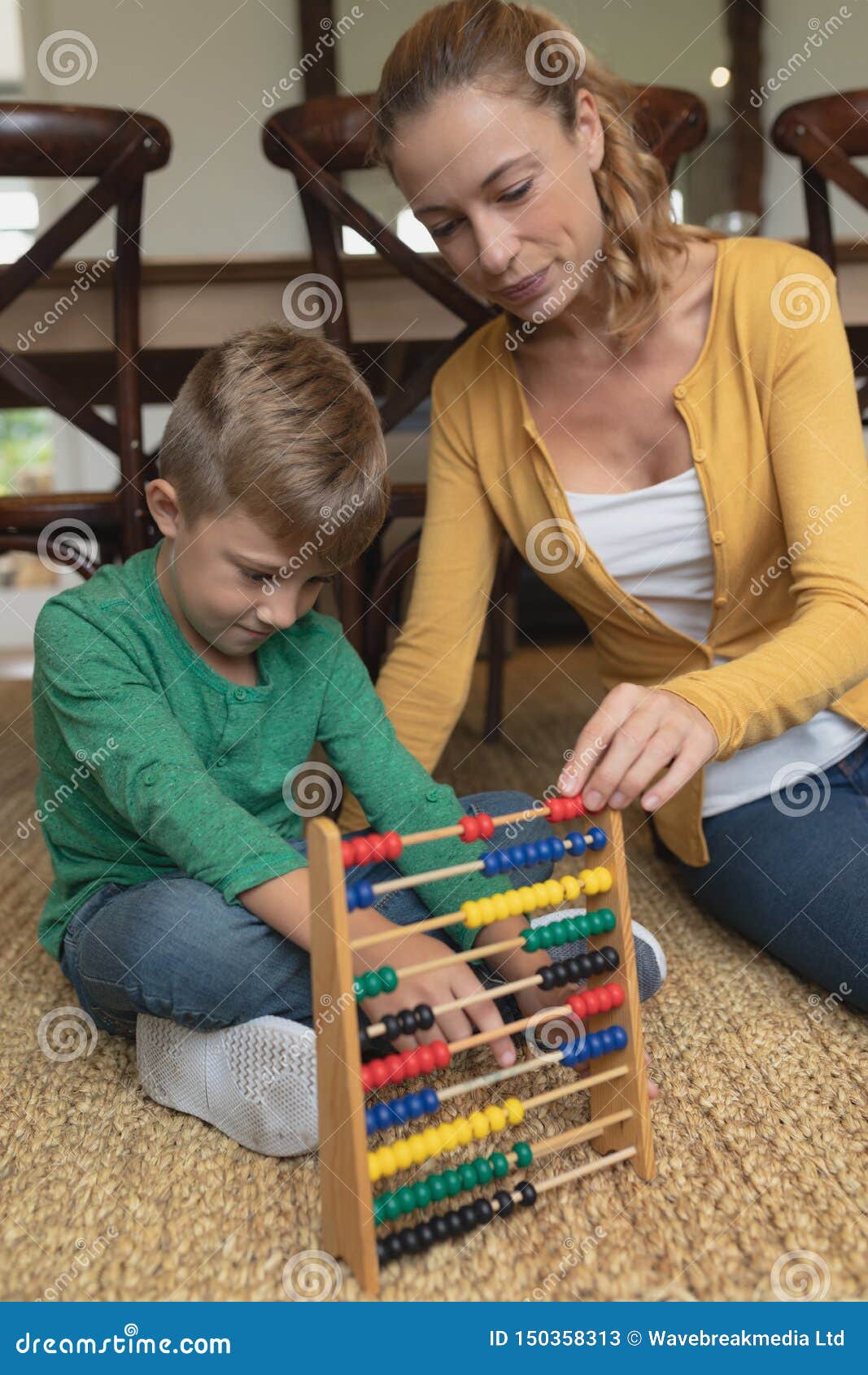 Mother Teaching Her Son Mathematics with Abacus in a Comfortable Home ...