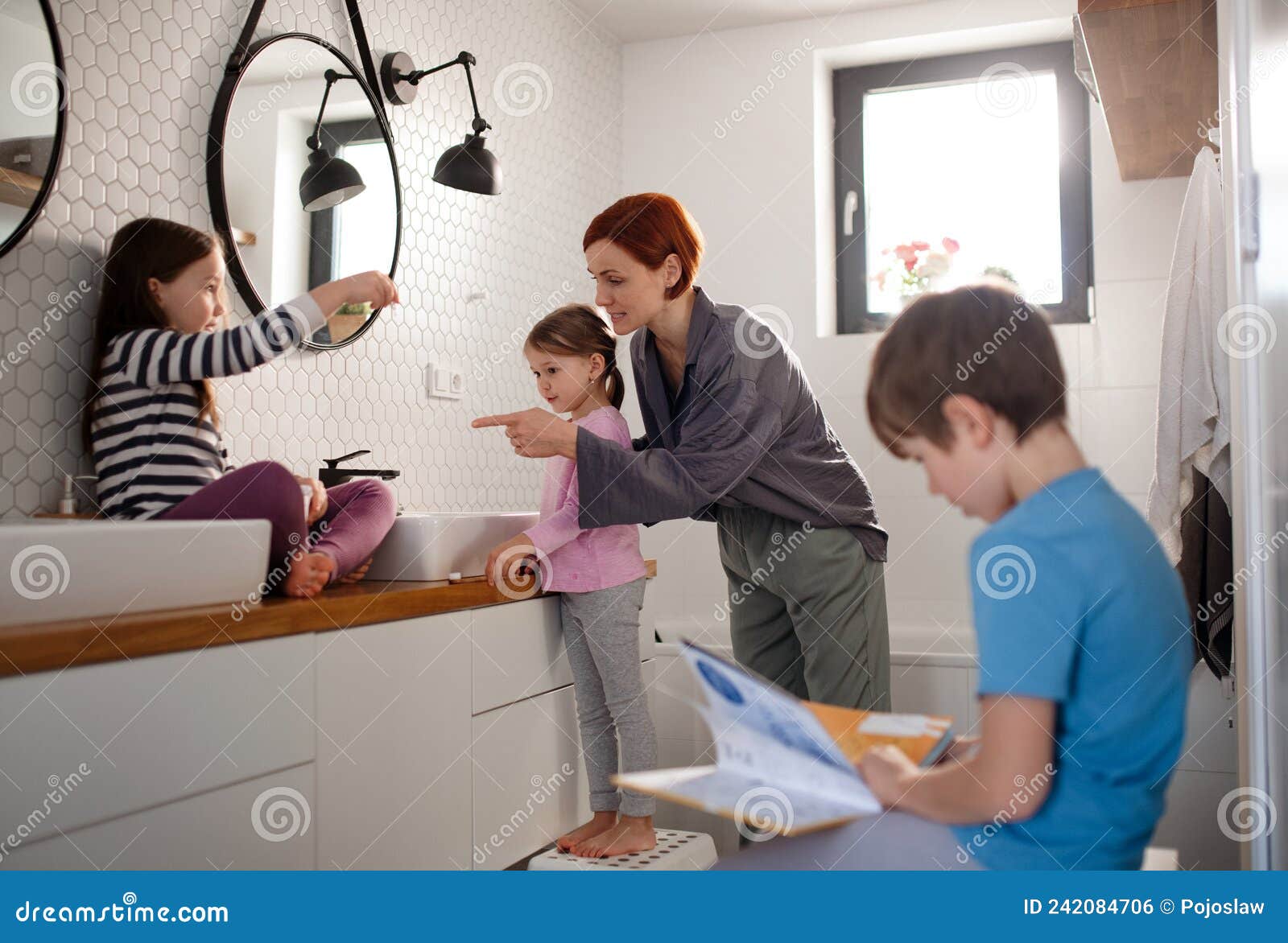 Mother with Three Little Children in Bathroom, Morning Routine Concept ...