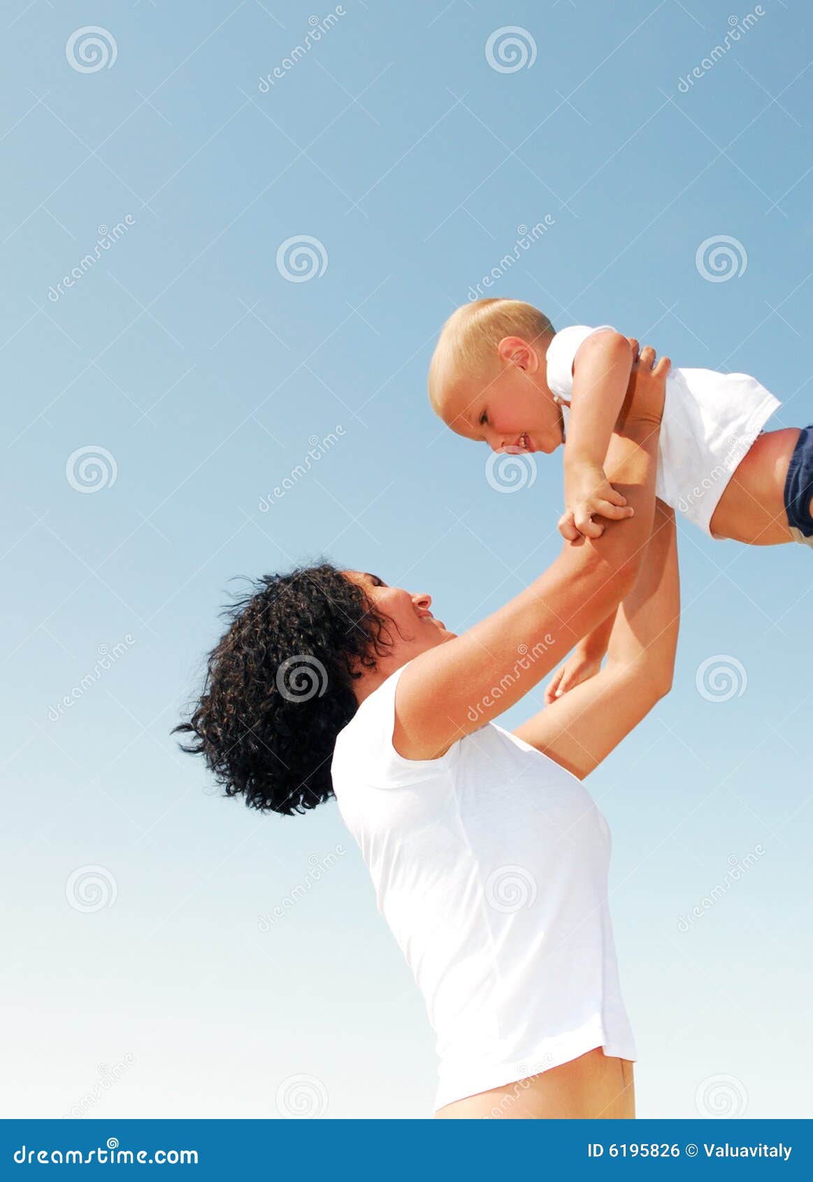 Mother toss up cute boy stock photo. Image of clothes - 6195826