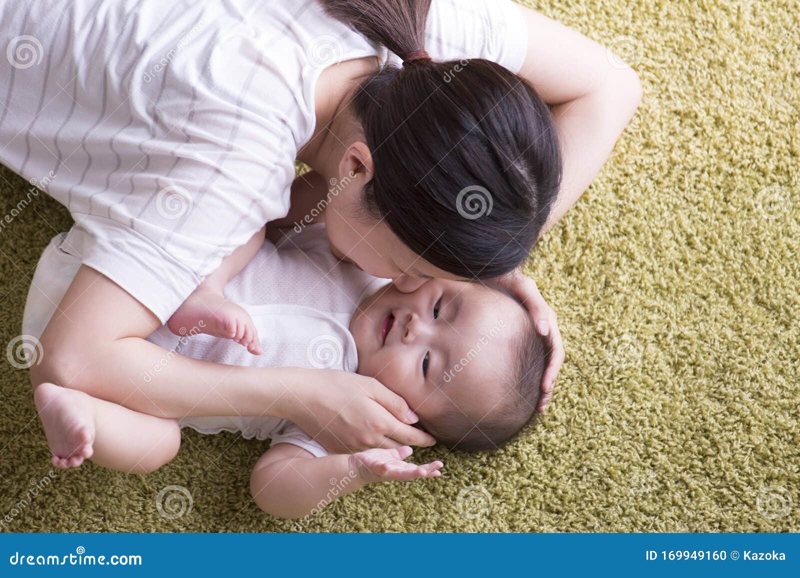 Mother touching baby stock photo. Image of lifestyle - 169949160