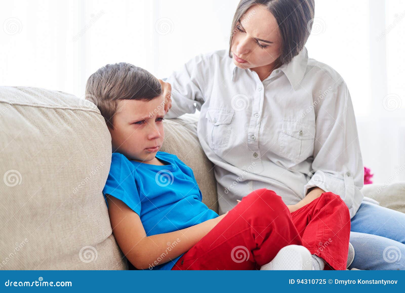 Mother Trying To Comfort And Calm Down Her Disappointed Son Stock Image