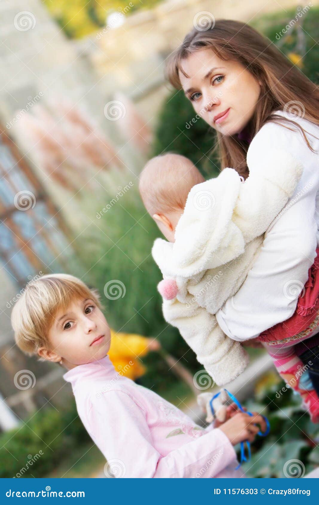 Mother with two children stock image. Image of hold, calm - 11576303