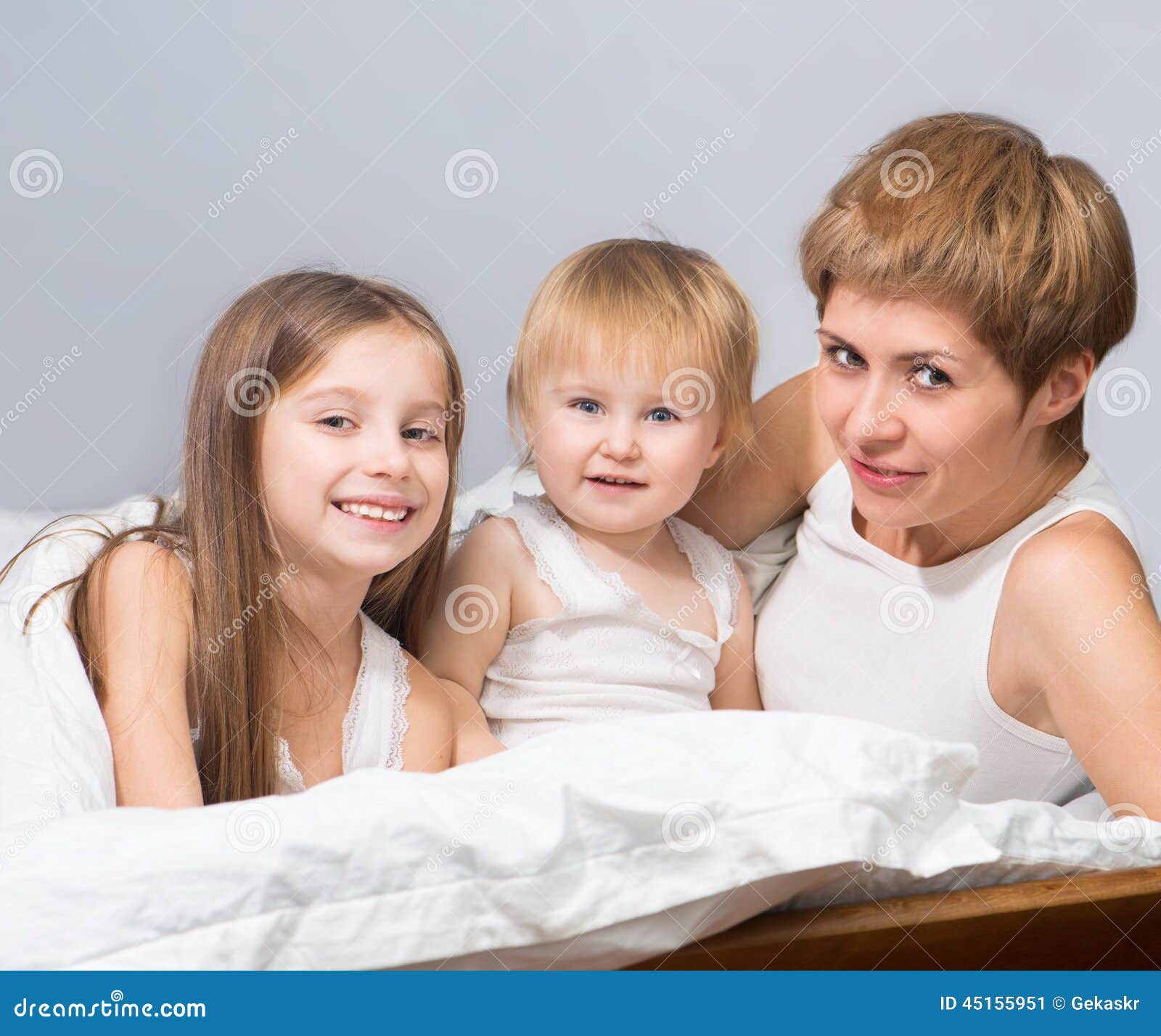 Mother with two children stock image. Image of isolated - 45155951