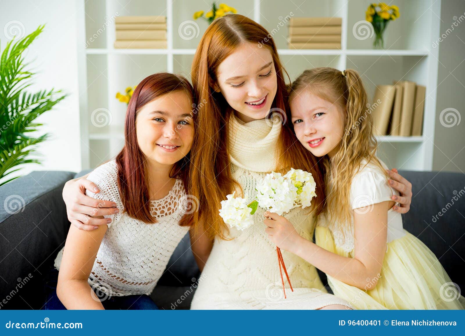 Mother with two daughters stock image. Image of greeting - 96400401