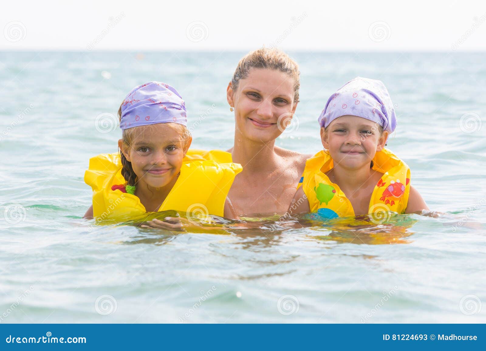 Mother and Two Daughters Swimming in Sea Stock Image - Image of shore ...