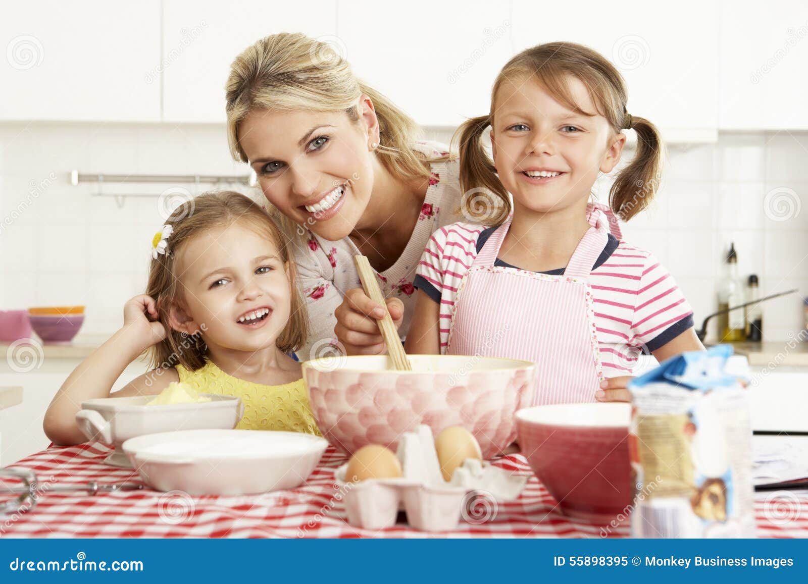 Mother and Two Girls Baking in Kitchen Stock Image - Image of cooking ...