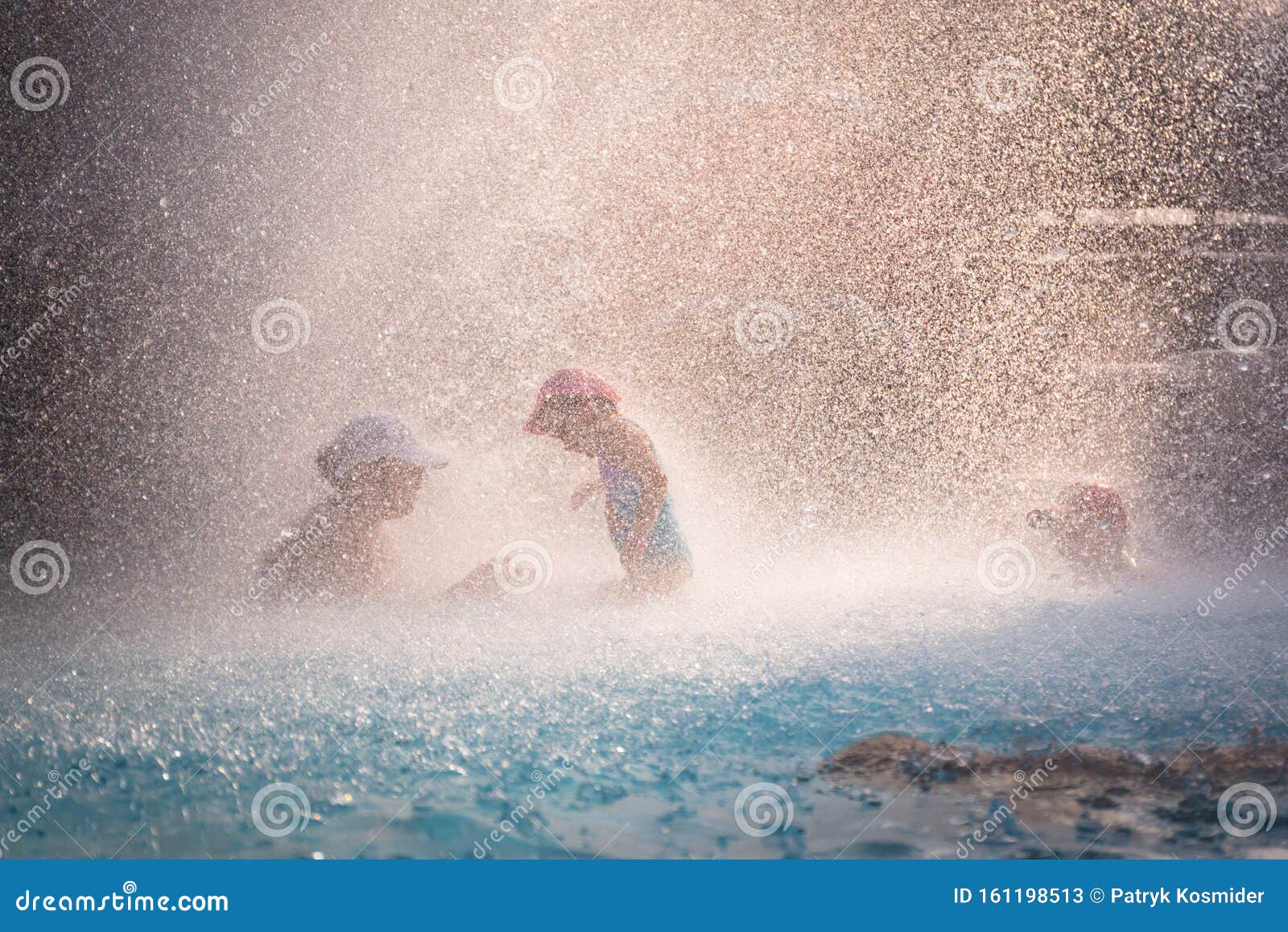 Mother with Two Kids Splashed by Water in the Pool Stock Image - Image ...