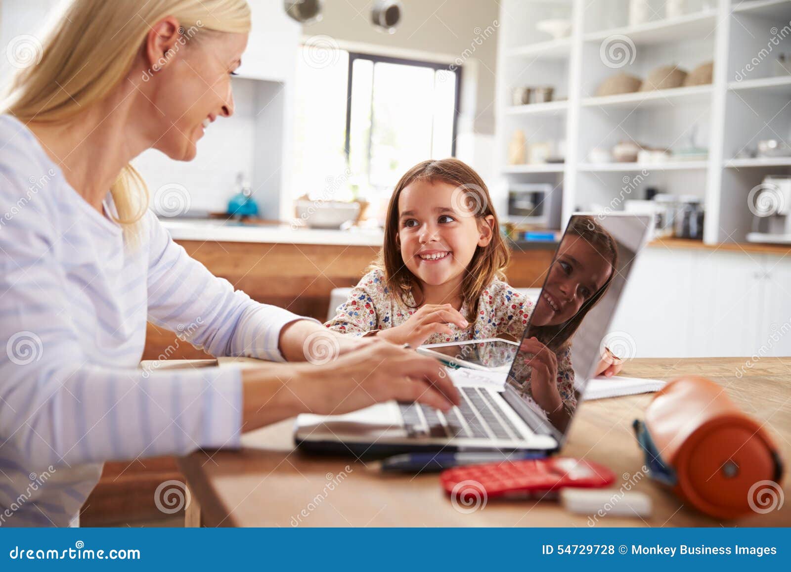 Mother Using Laptop Computer with Her Young Daughter Stock Photo ...