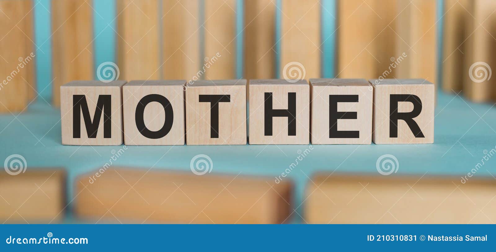 MOTHER Word Written on Wooden Blocks on Light Blue Background Stock ...