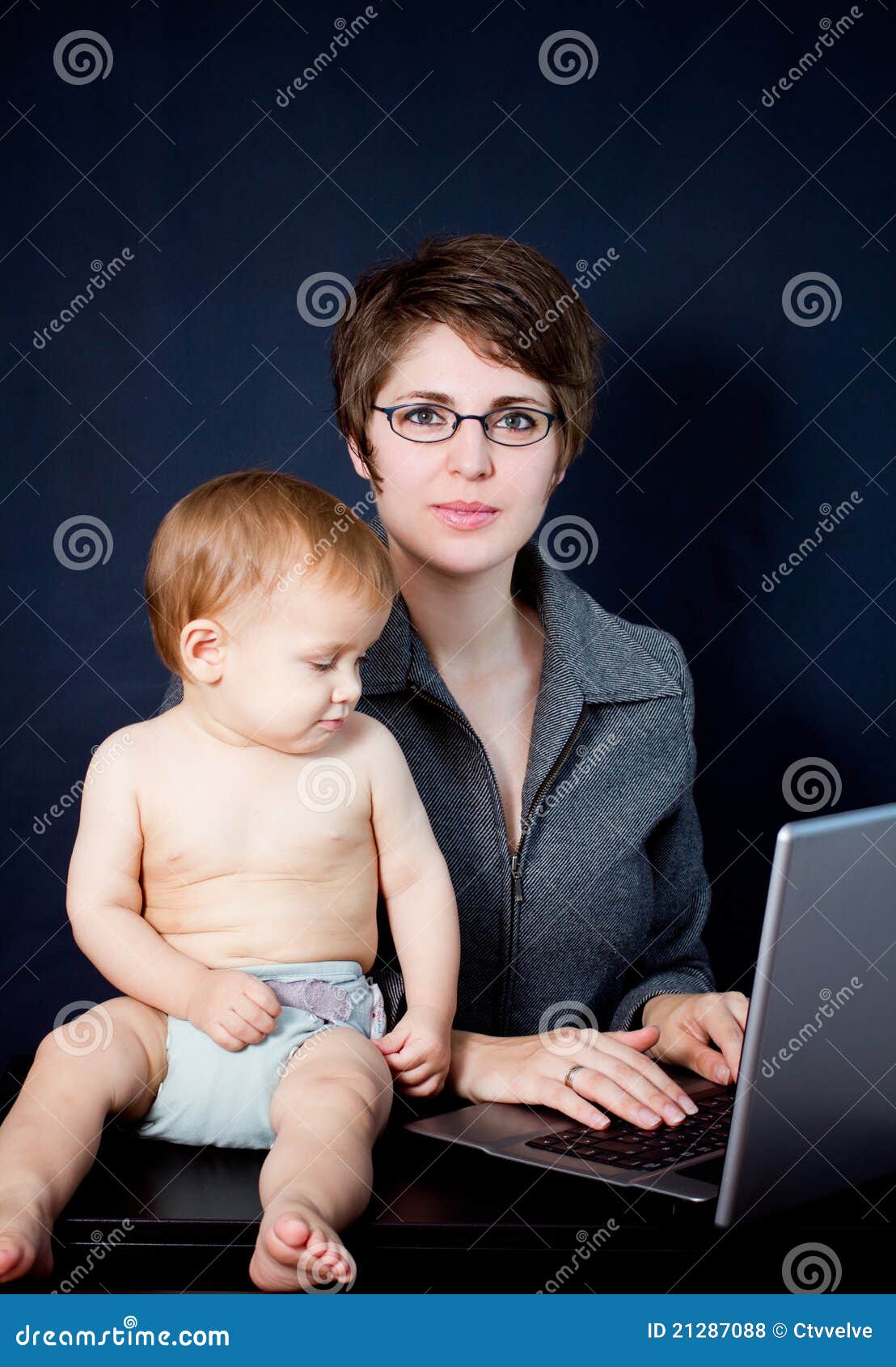 Mother Working with Her Baby Stock Photo - Image of home, complexity ...