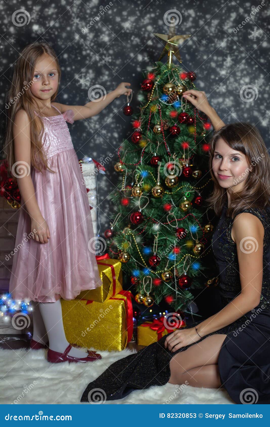 Mother with Your Child Decorating the Christmas Tree Stock Image ...