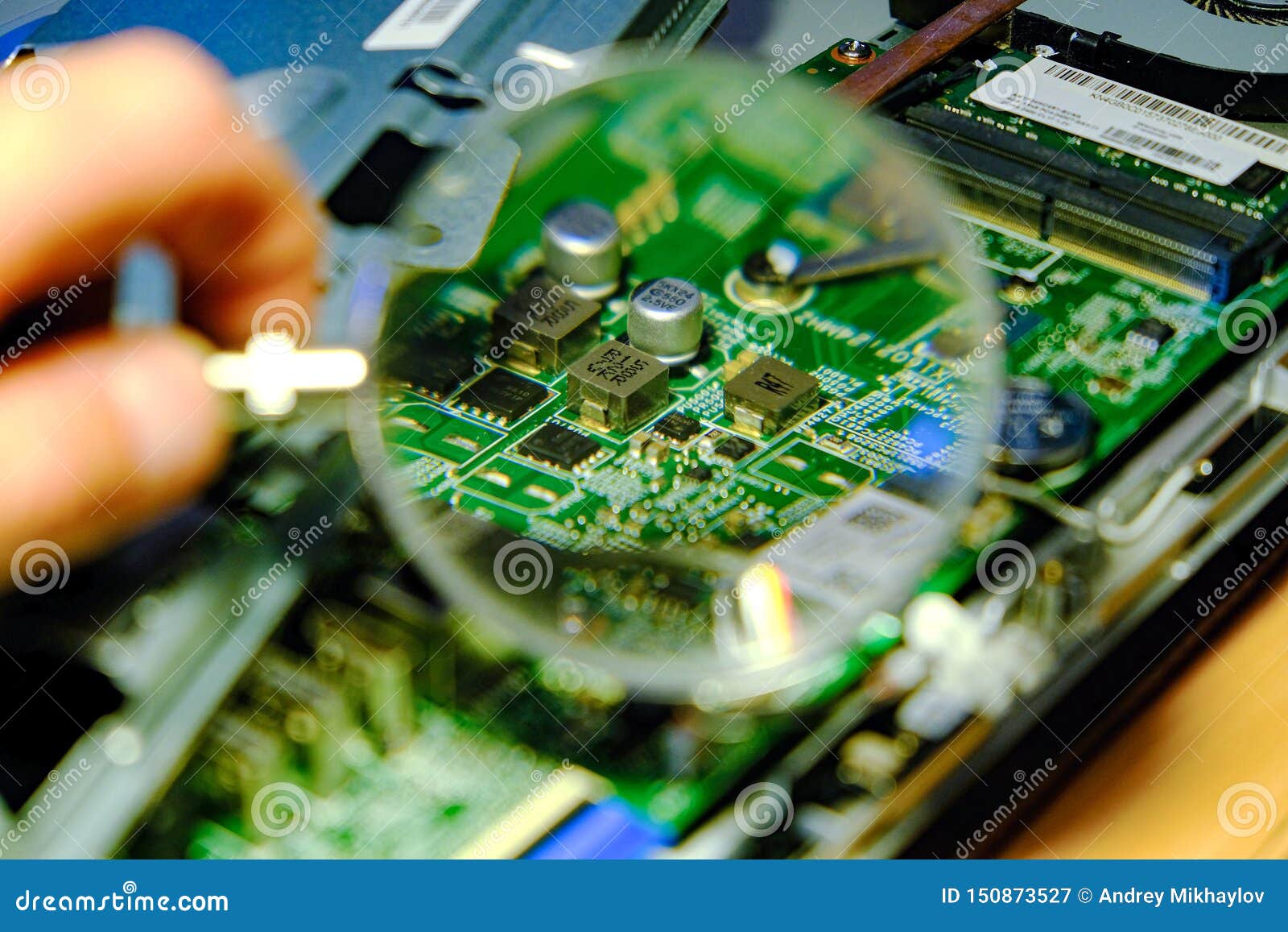 The Motherboard is Magnified through a Magnifying Glass. Hardware ... The Motherboard is Magnified through a Magnifying Glass. Hardware ...