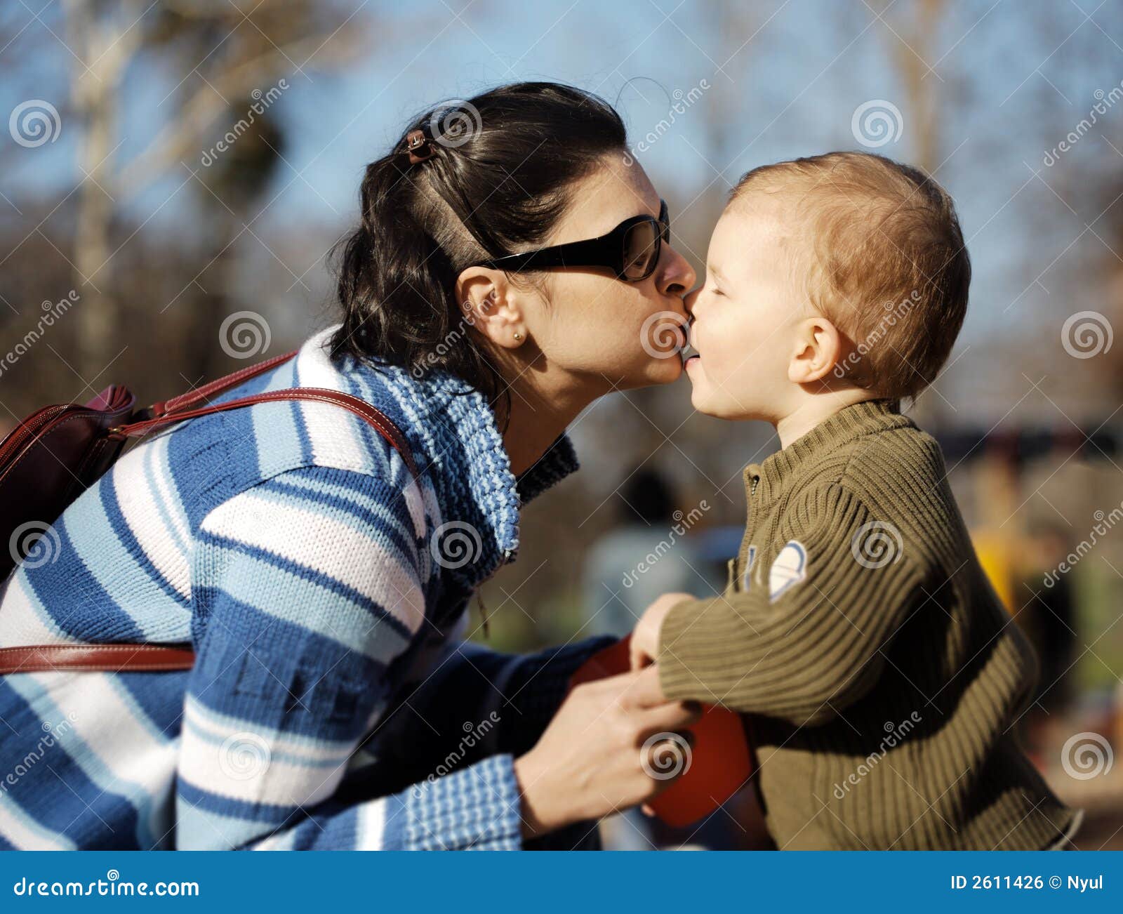 Motherly Love stock photo. Image of citypark, people, kids - 2611426