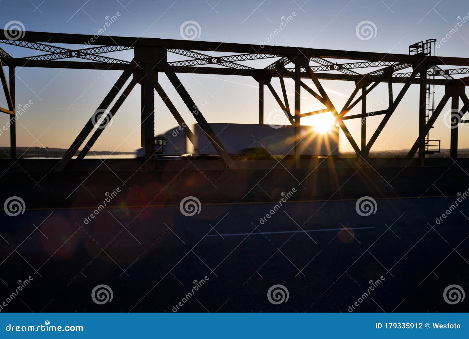 Motion Blurred Big Rig on Bridge at Sunset Stock Photo - Image of ...