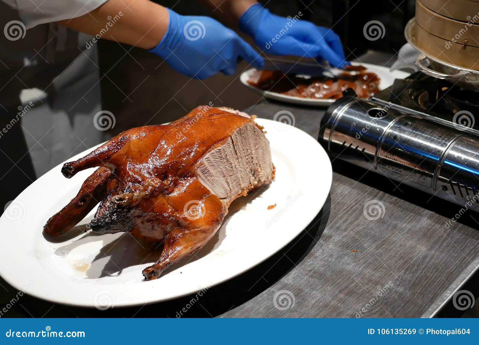 Motion of Chef Cutting Roasted Duck into a Plate Stock Image - Image of ...