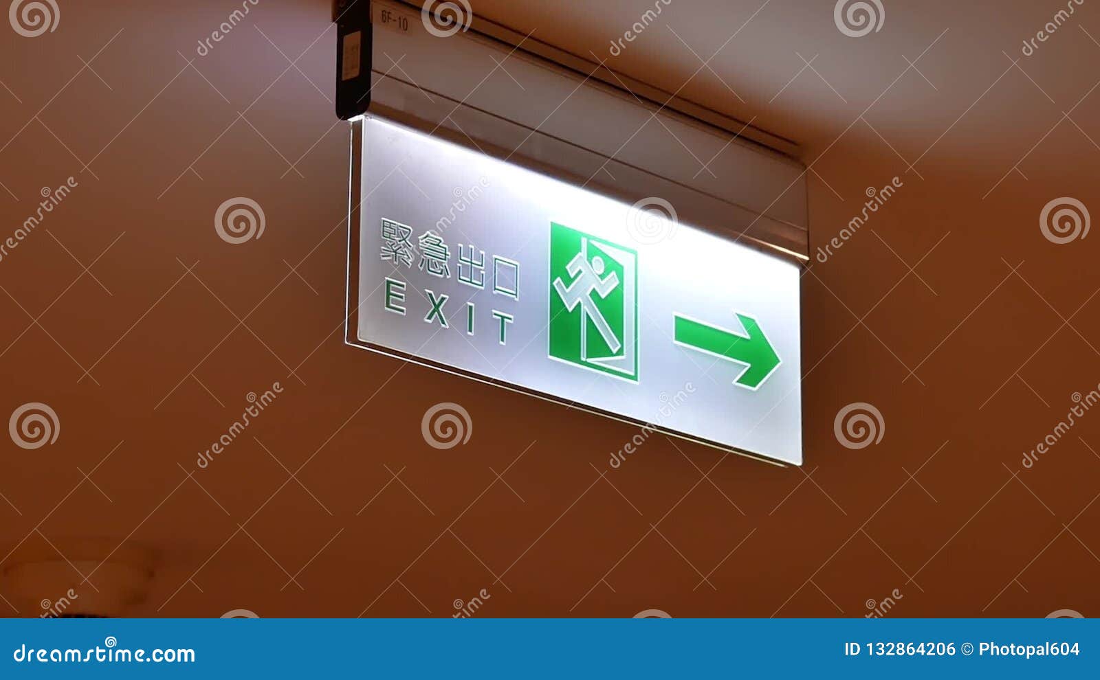 Motion of Emergency Exit Sign on Ceiling Inside Shopping Mall Stock ...