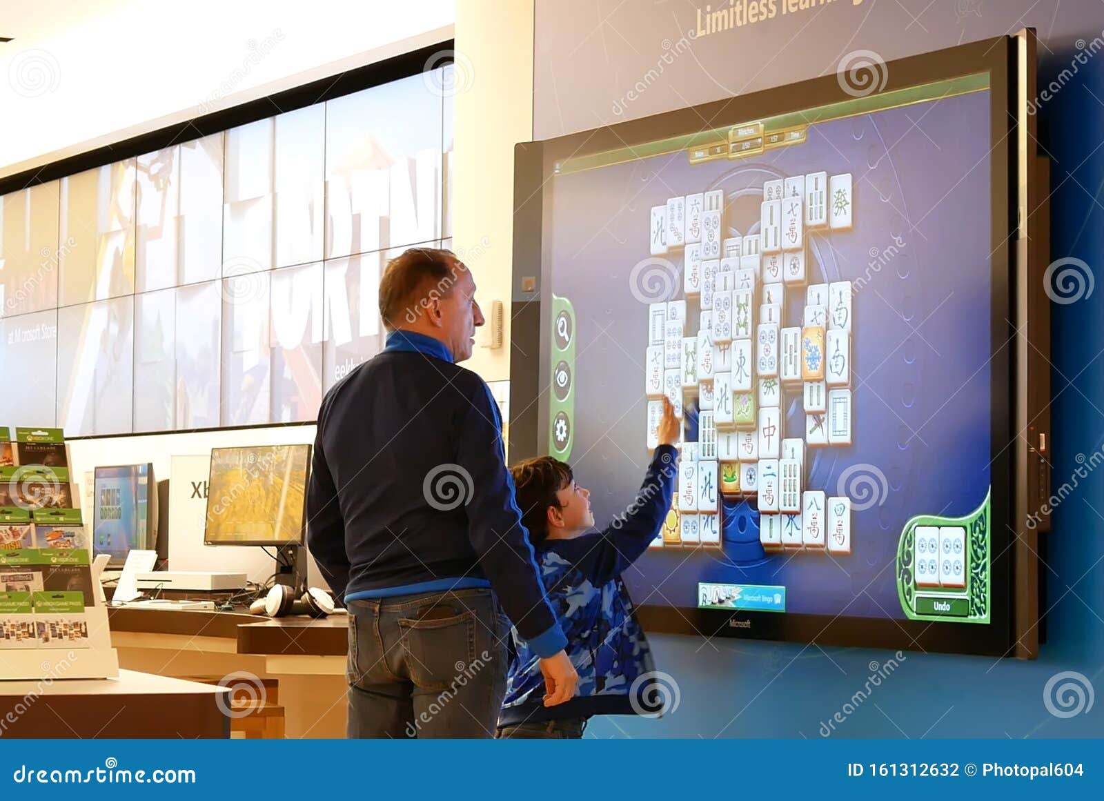 Motion of Father and Children Playing Xbox Game on Tv Screen Editorial ...