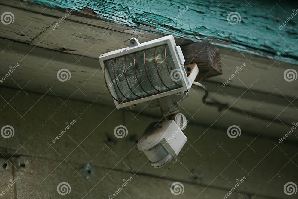 Motion Sensor and LED Spotlight on the Wall of the Building. Automatic ...