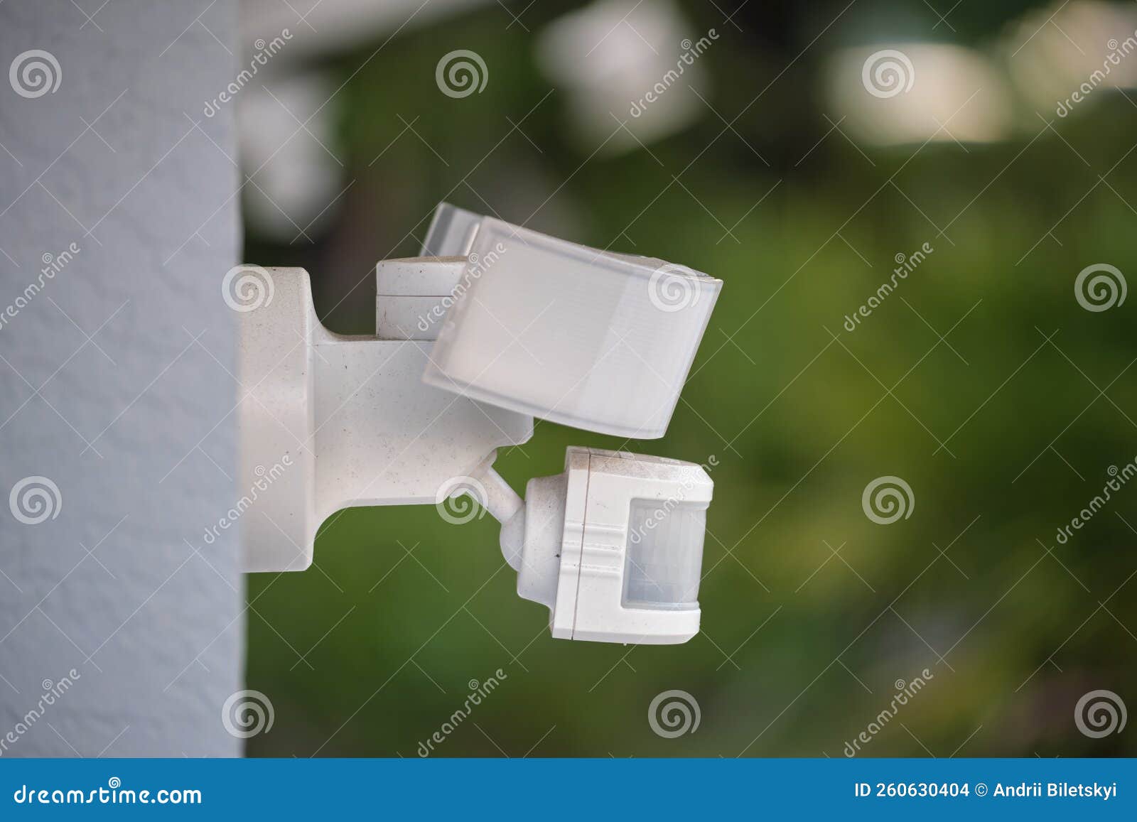 Motion Sensor with Light Detector Mounted on Exterior Wall of Private ...
