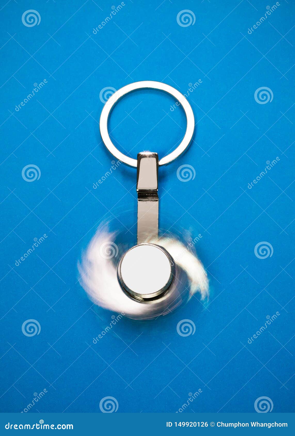 Motion of Spinning or Key Ring on Blue Paper Background. Blank Key ...