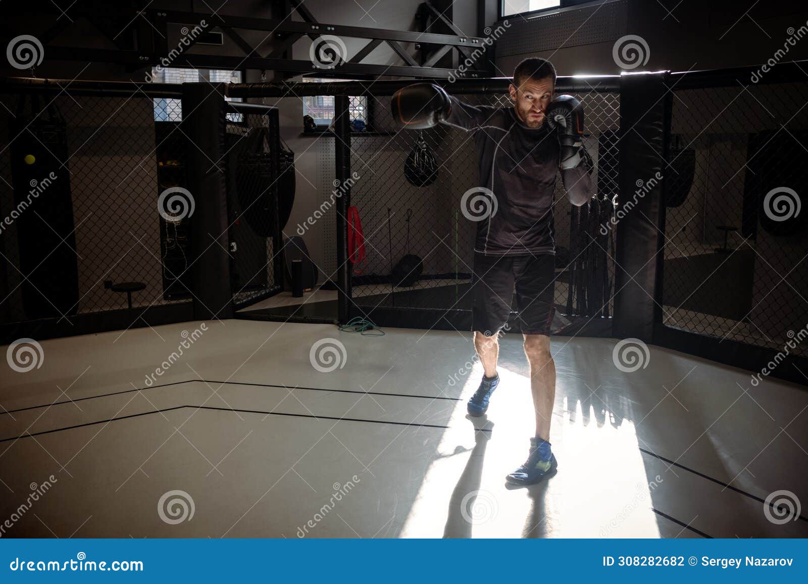 Motivated Boxer Honing Punching Technique in Shadow Fighting Stock ...
