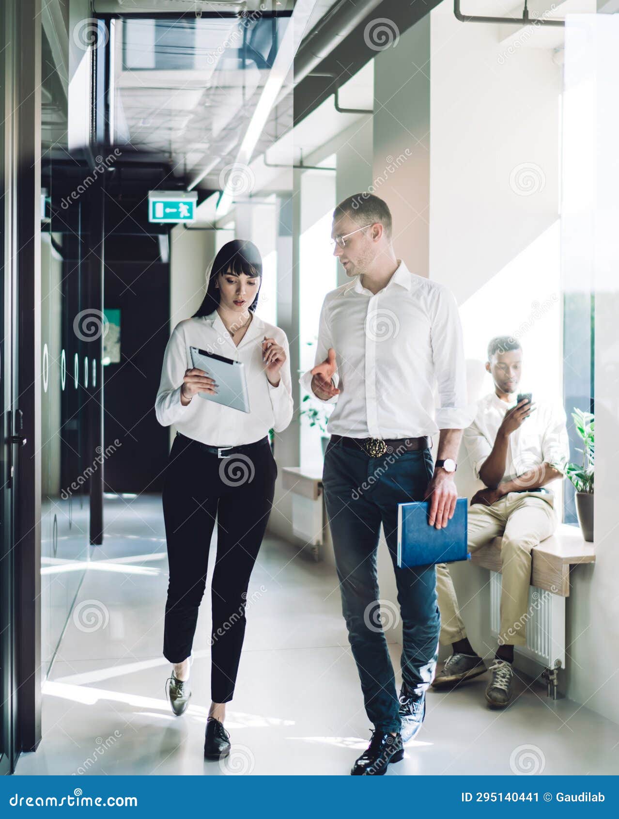 Motivated Workmates Communicating at Workplace Stock Image - Image of ...