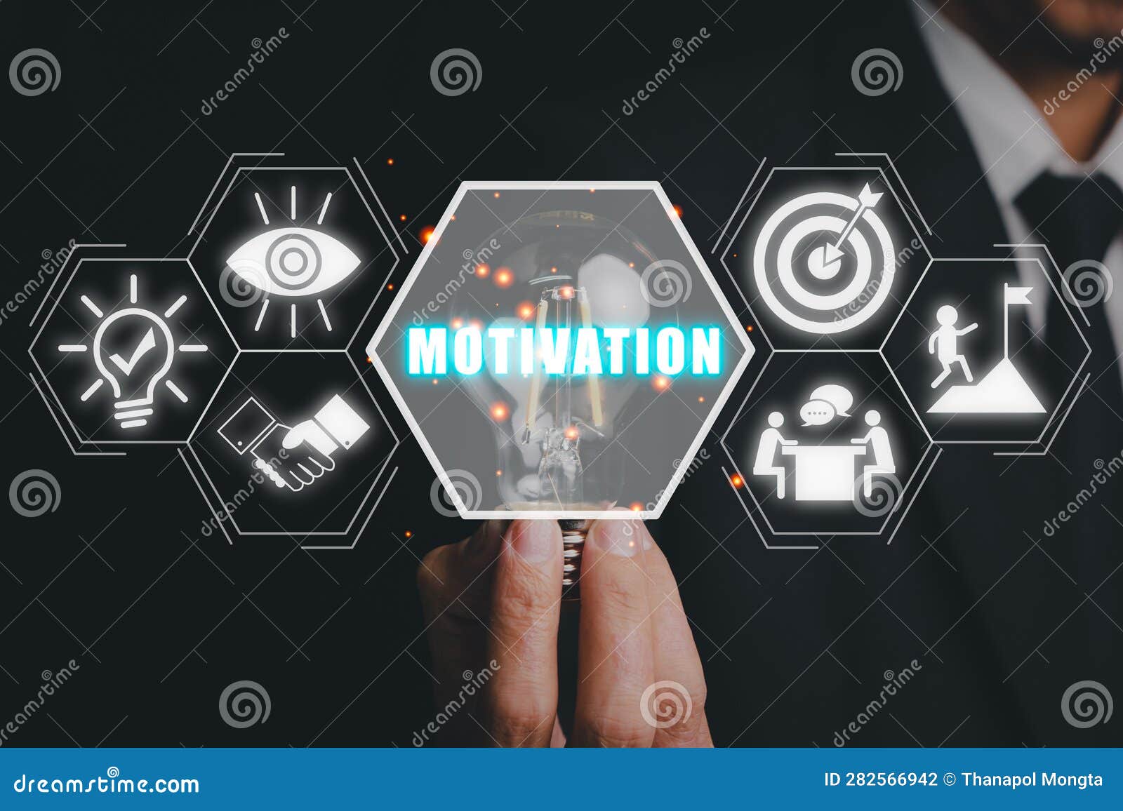 Businessman Hand Holding Light Bulb with Motivation Icon on Virtual ...