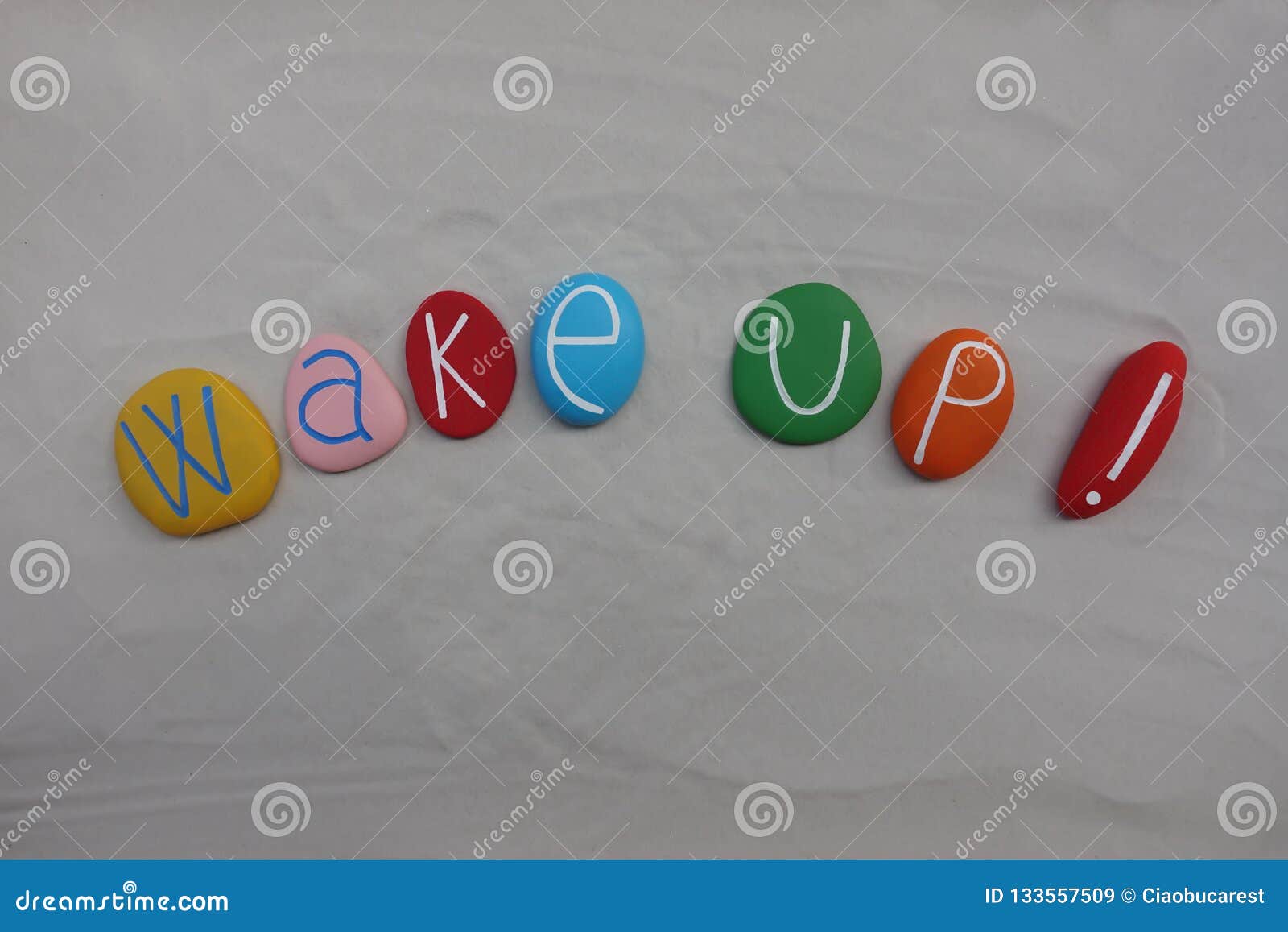 Wake Up ! Motivational Sentence with Colored Stones Over White Sand ...