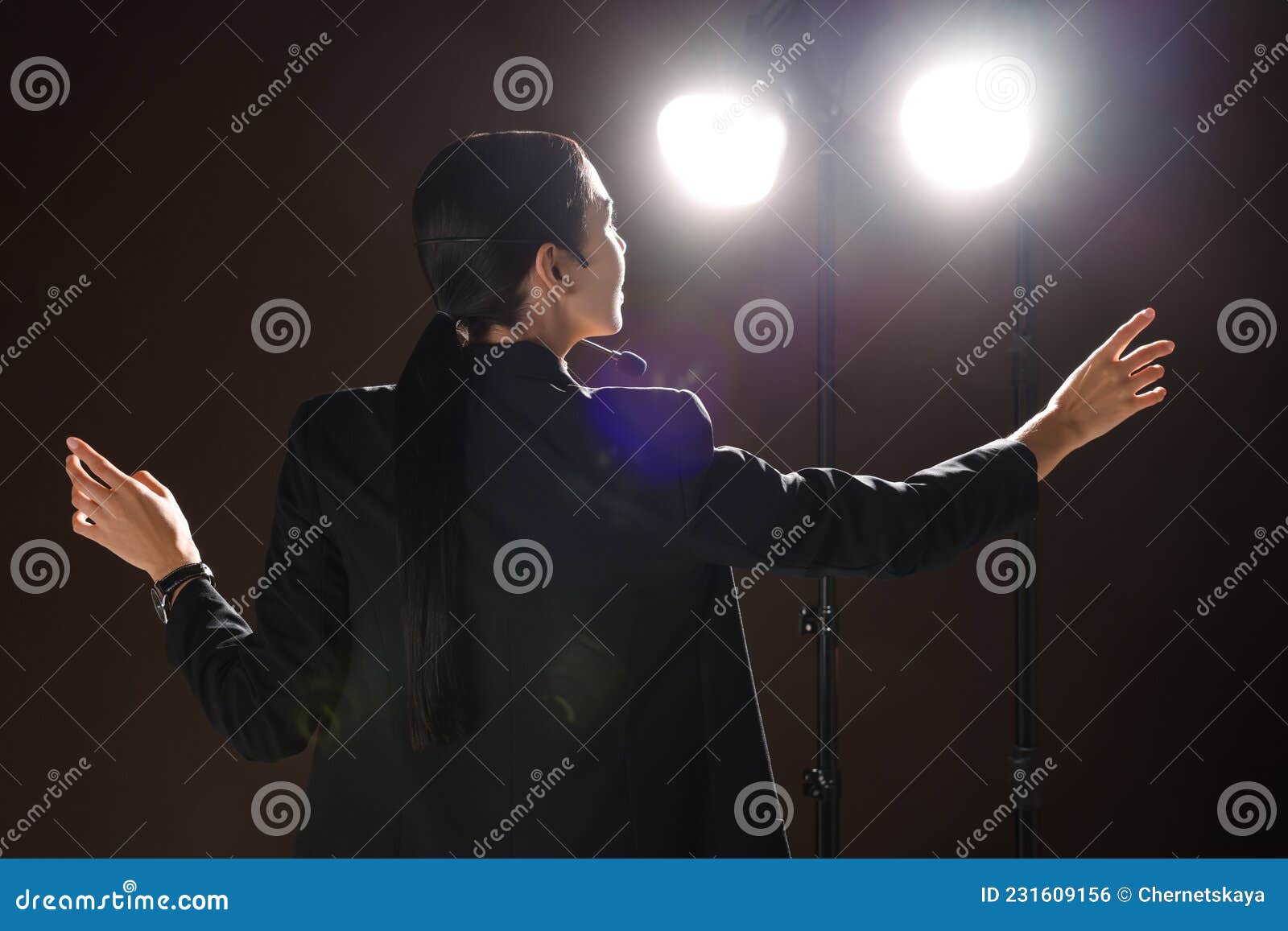 Motivational Speaker with Headset Performing on Stage, Back View Stock ...