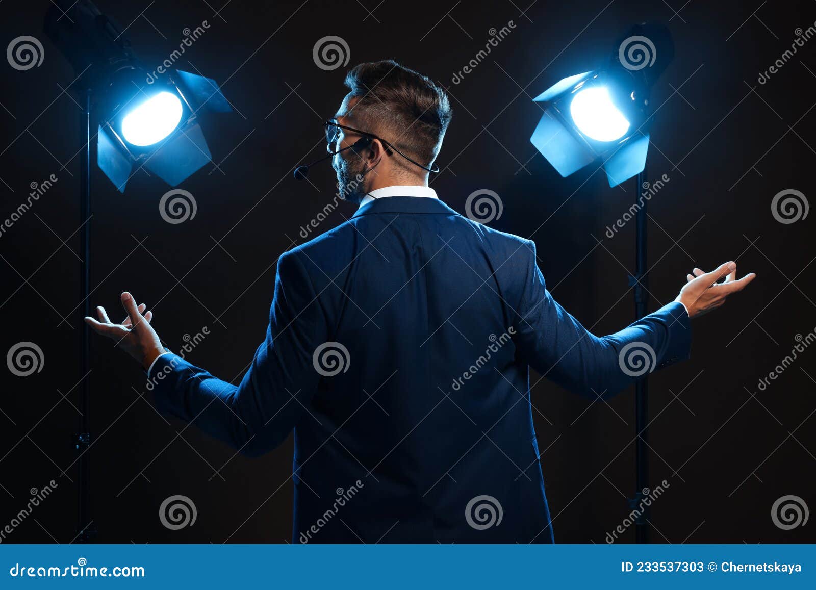 Motivational Speaker with Headset Performing on Stage, Back View Stock ...