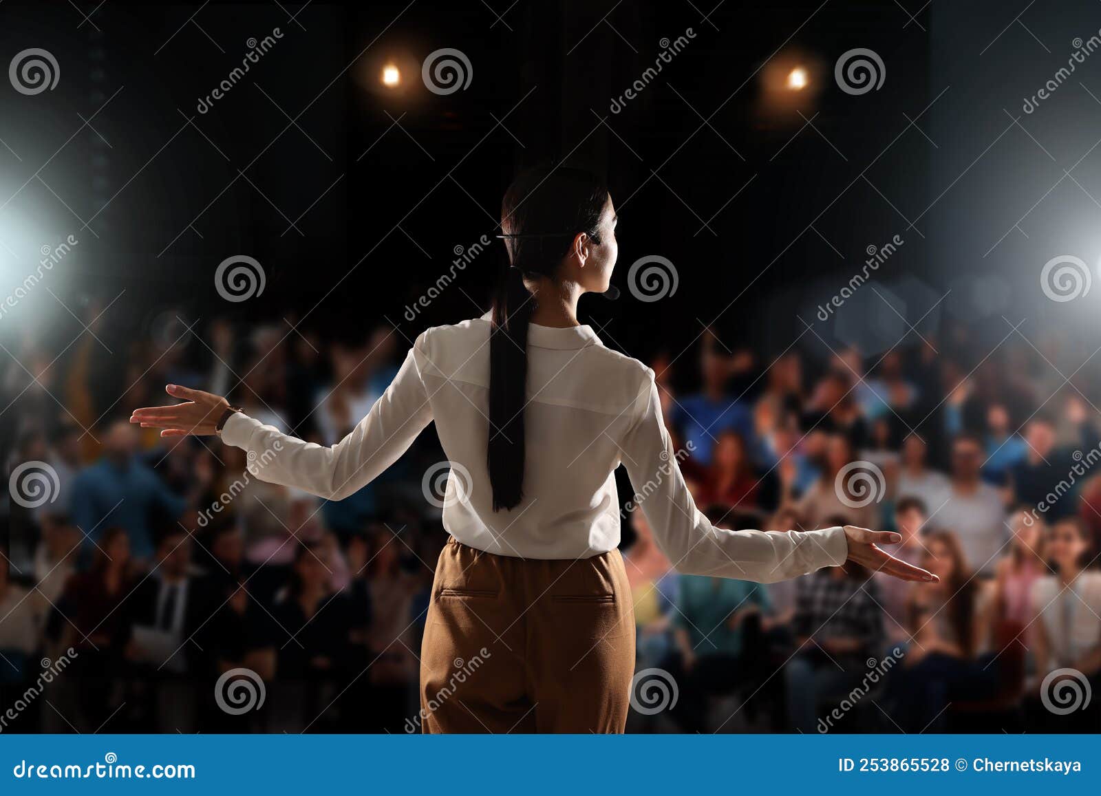 Motivational Speaker with Headset Performing on Stage, Back View Stock ...