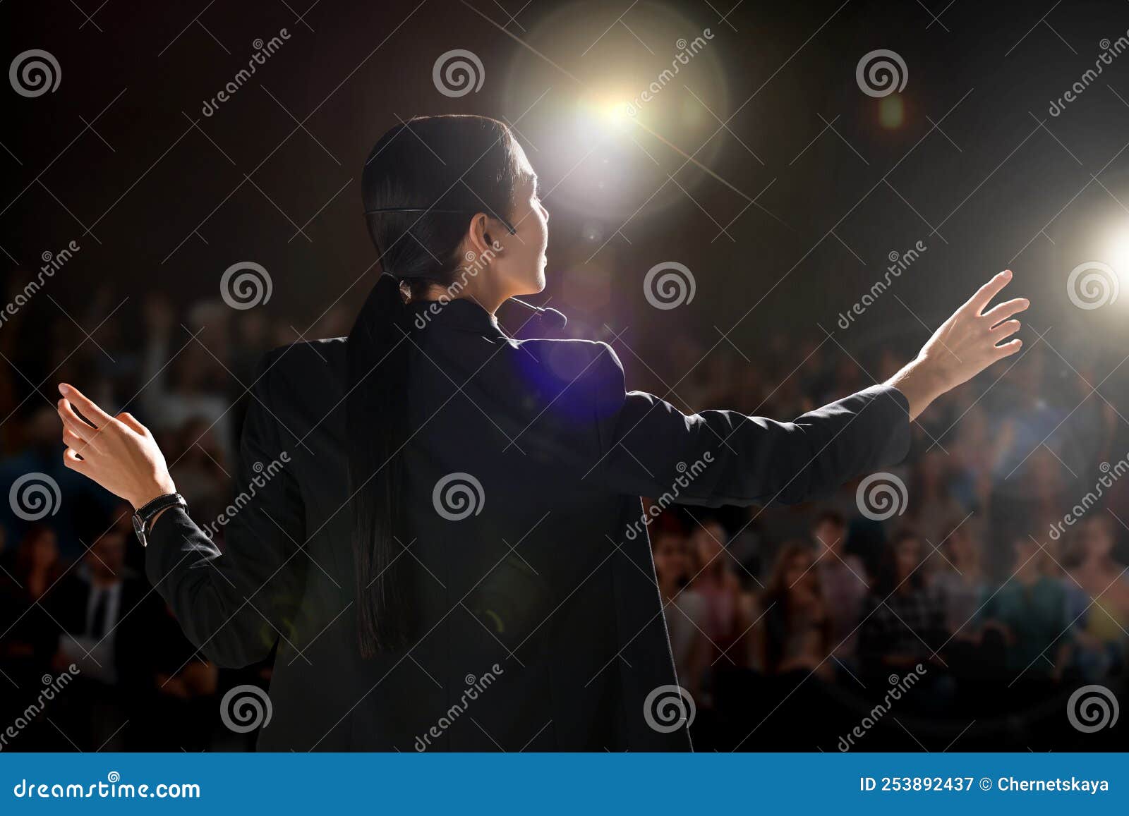 Motivational Speaker with Headset Performing on Stage, Back View Stock ...