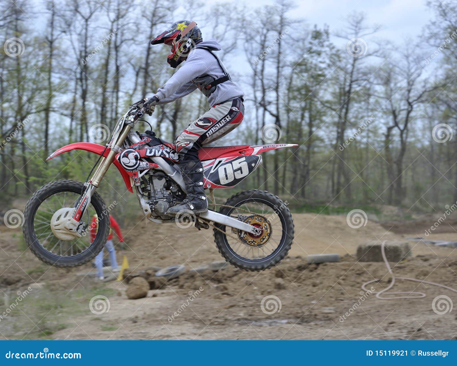 Motocross Racer Jumping Over a Small Hill Editorial Photo - Image of ...