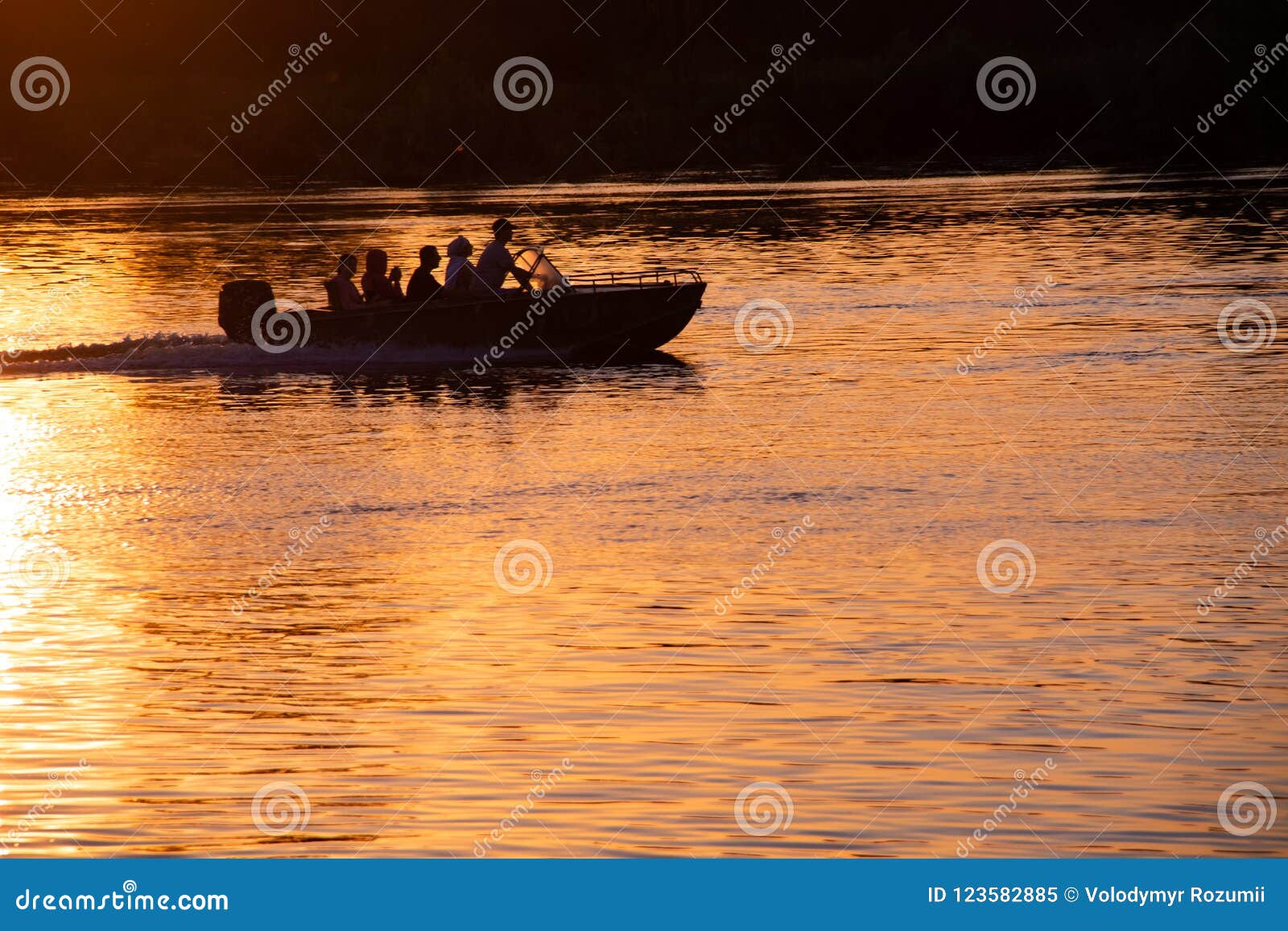 A Motor Boat Sails on the River at Sunset Stock Image - Image of ...