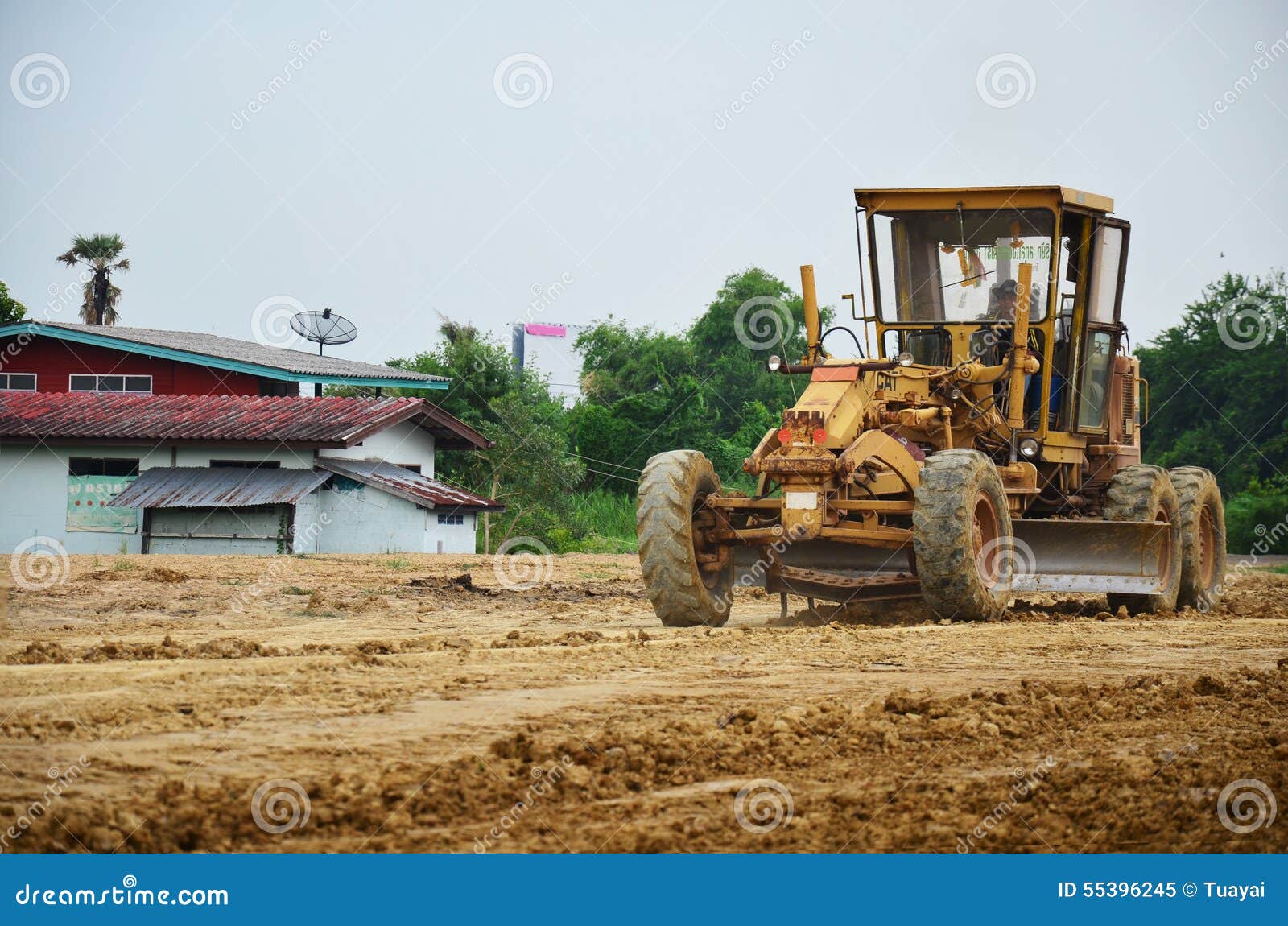 Motor Grade Machine and People Working at Construction Site Editorial ...
