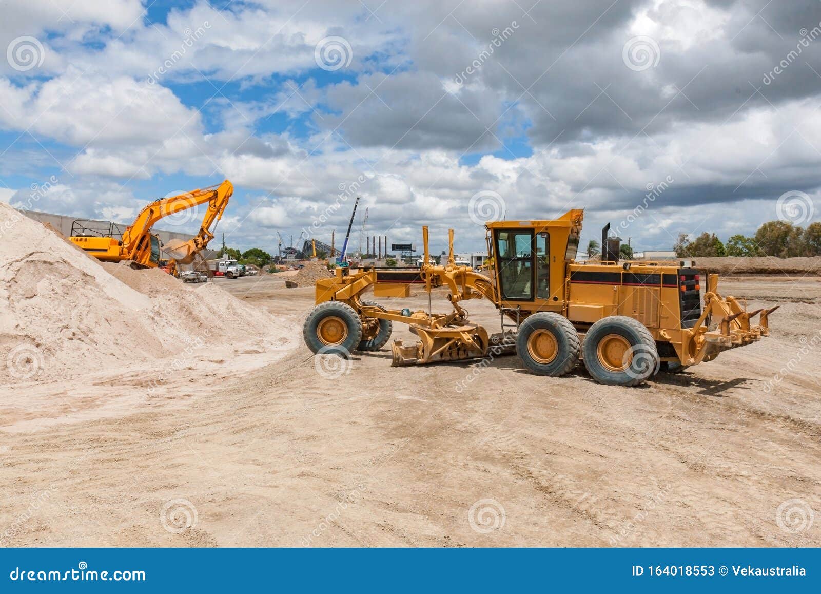 Motor Grader and Hydraulic Excavator on Construction Site Stock Image ...