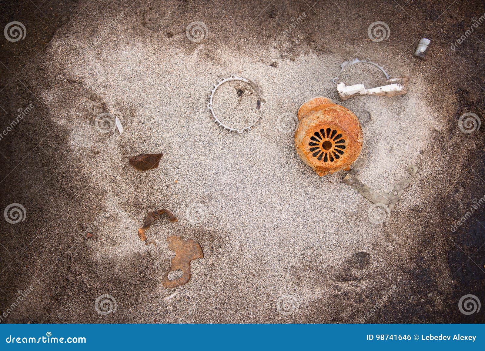 Motor parts on the sand stock photo. Image of detail - 98741646
