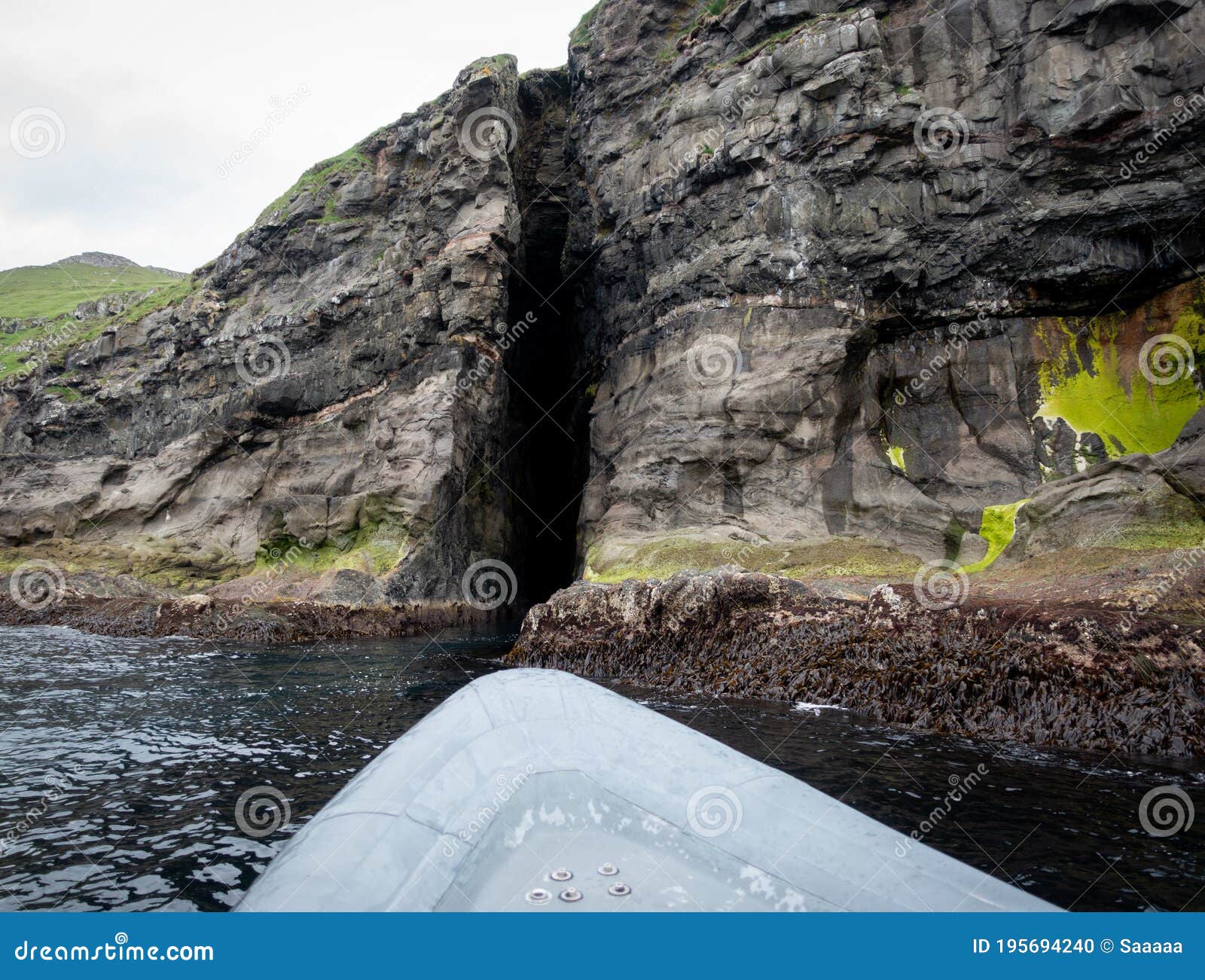 Motorboat Approaching To Crack in the Cliff Stock Photo - Image of ...