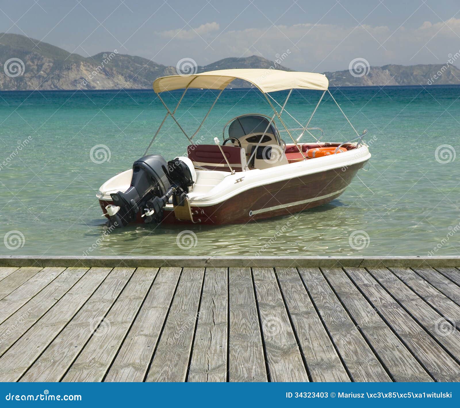 Motorboat moored by jetty stock image. Image of creative - 34323403