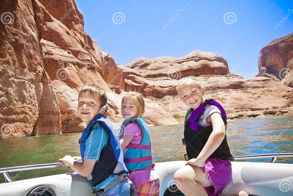 Motorboating Fun - Children Stock Photo - Image of girl, looking: 22559966