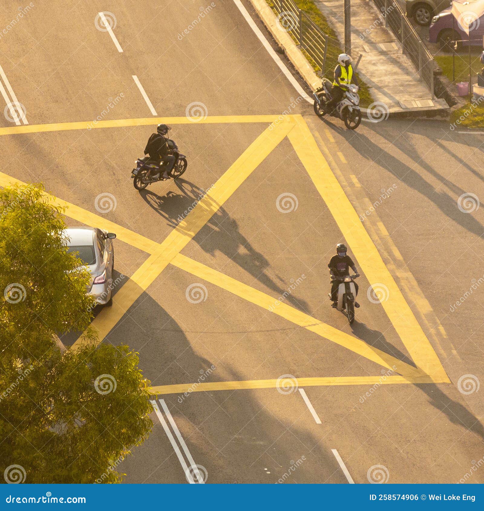 Motorcycle Crossing Junction - Sunset Stock Photo - Image of traffic ...