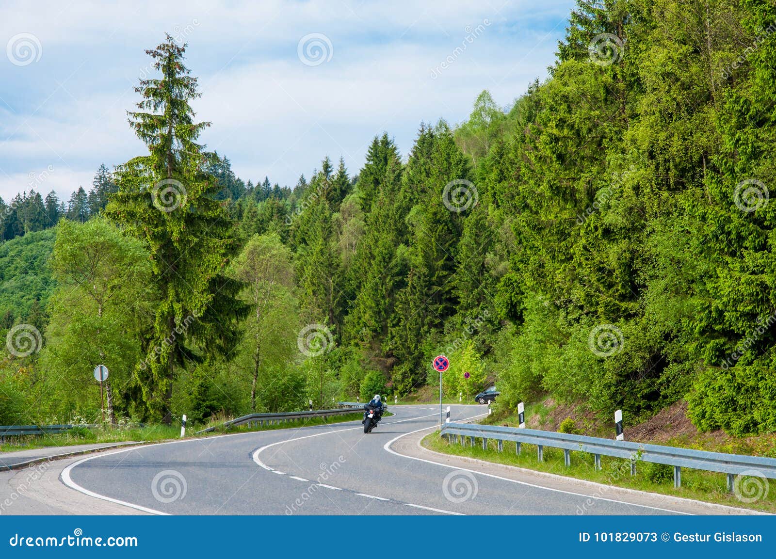 Motorcycle Driver Riding in the Forest Stock Image - Image of spring ...