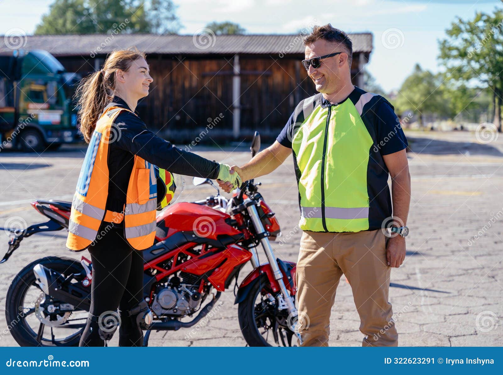 Motorcycle Driving School. Instructor and Student Handshake before ...